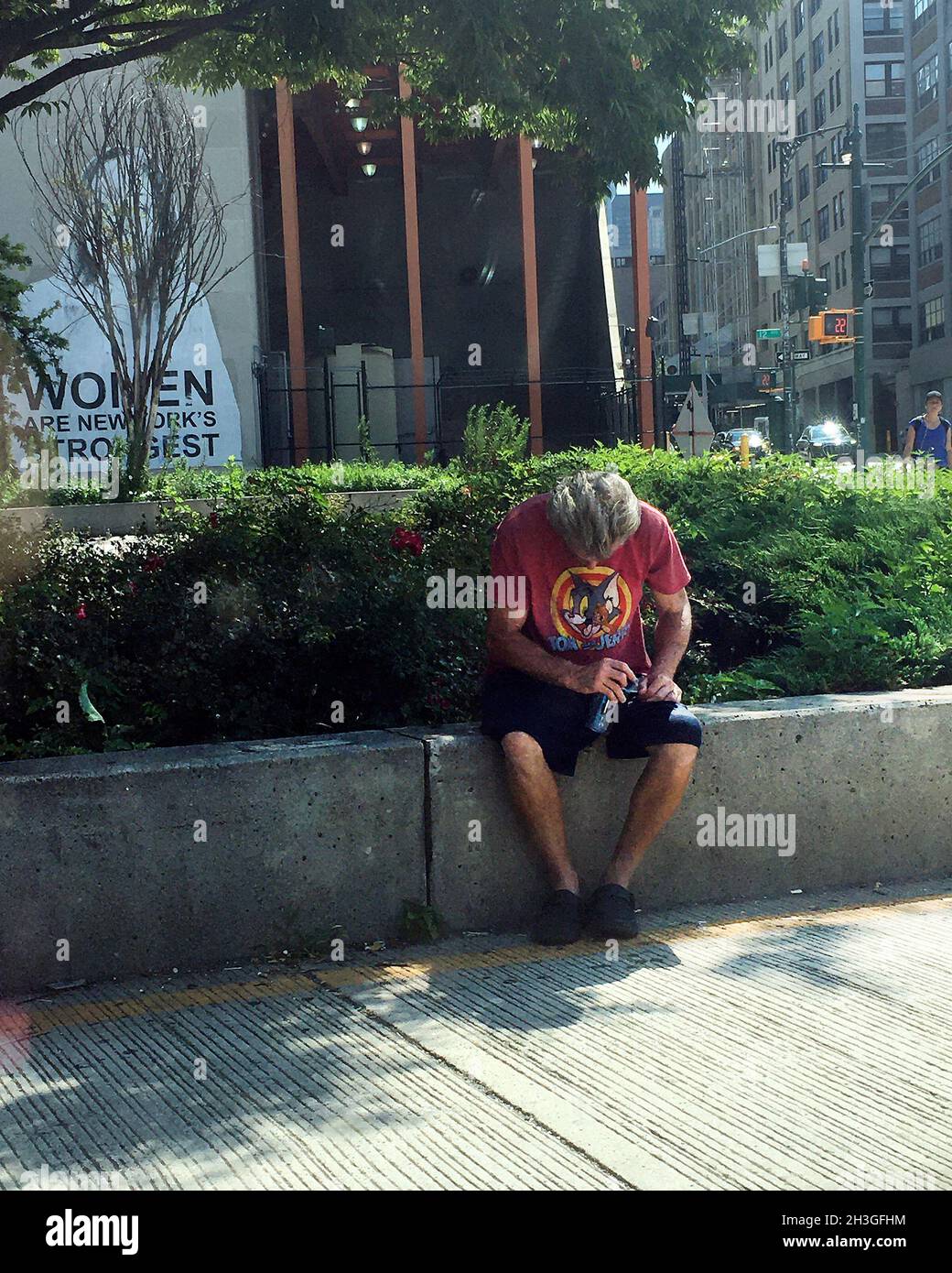 New York, New York, USA. 28th Oct, 2021. A homeless man sits along the ...