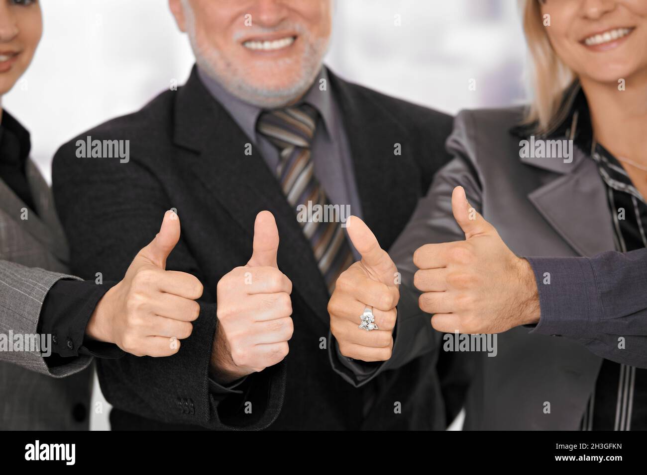 Four hands giving thumbs up hi-res stock photography and images - Alamy