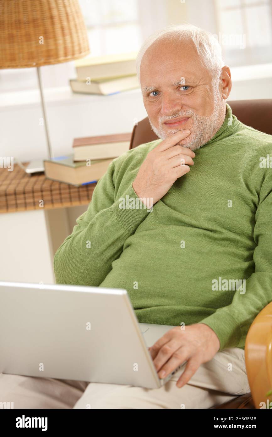Portrait of senior man with laptop computer Stock Photo - Alamy
