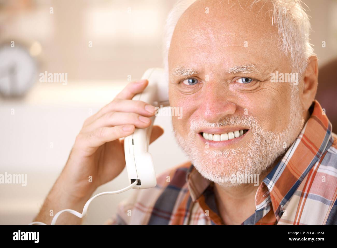 Portrait of smiling senior using landline phone Stock Photo - Alamy Portrait of smiling senior using landline phone Stock Photo - Alamy