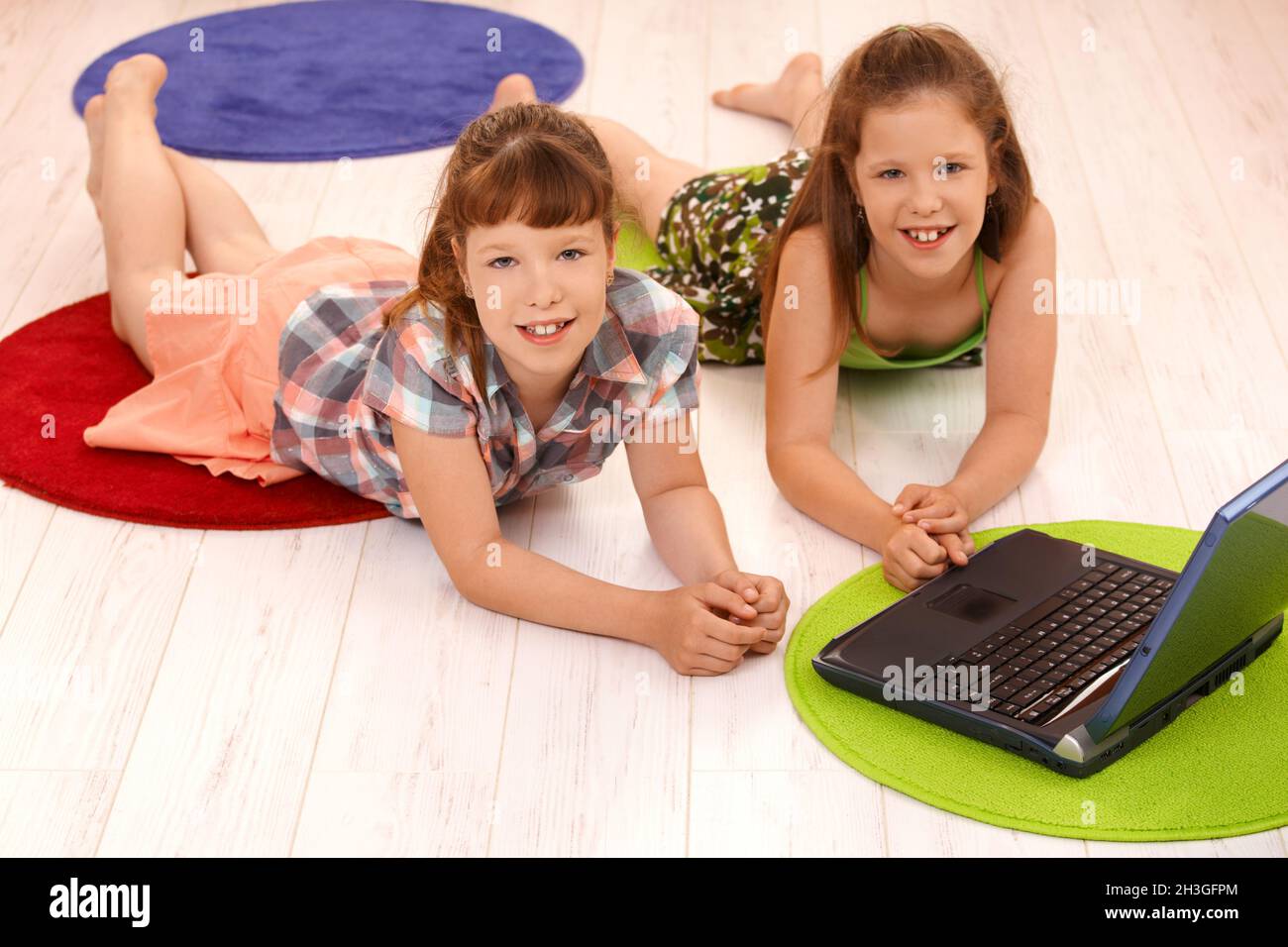 Portrait of small girls with computer Stock Photo - Alamy