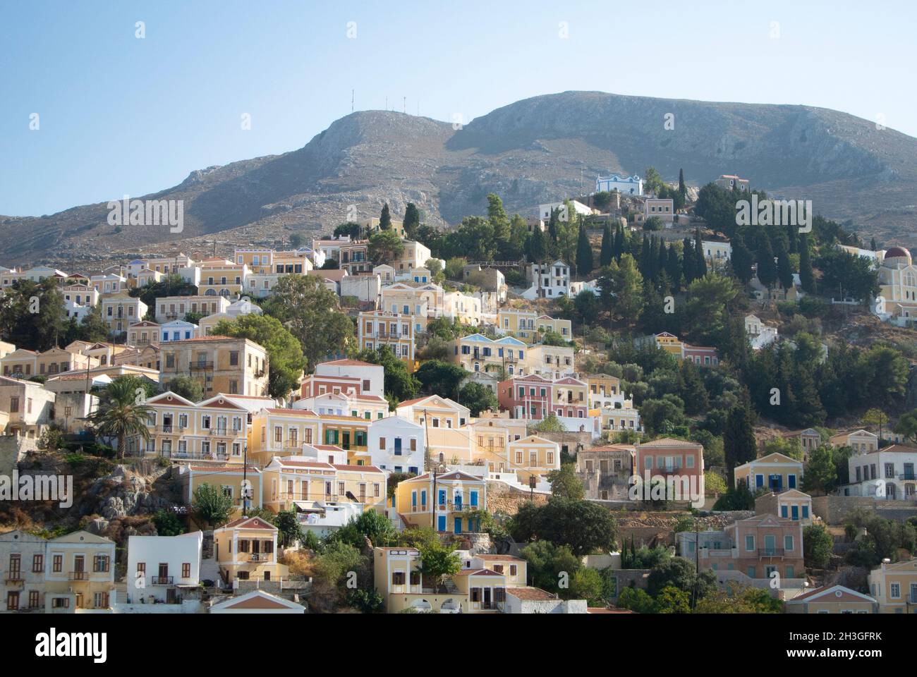 Beautiful Symi island, Greece View of neo classical houses on a ...