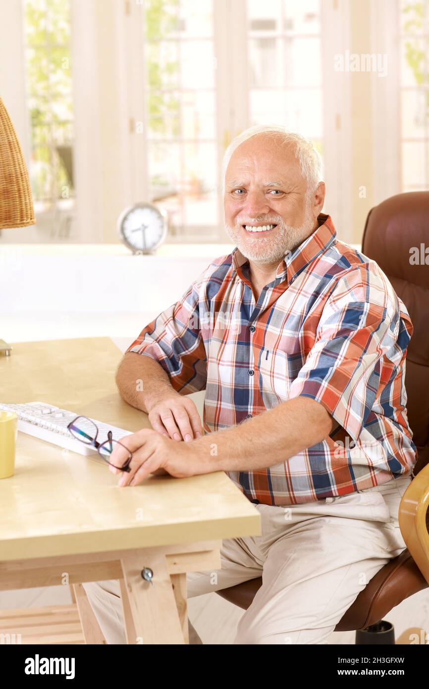 Portrait of elderly man in study at home Stock Photo - Alamy