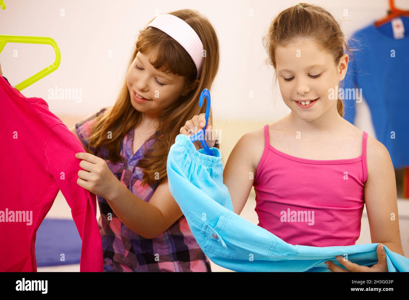 Portrait of girls with clothes Stock Photo - Alamy
