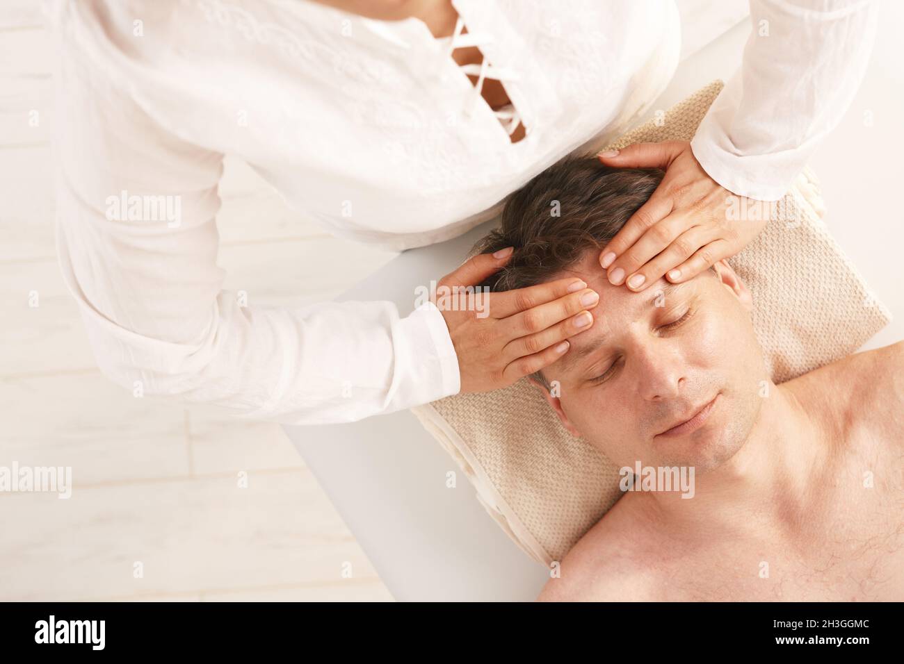Man getting relaxing head massage Stock Photo - Alamy