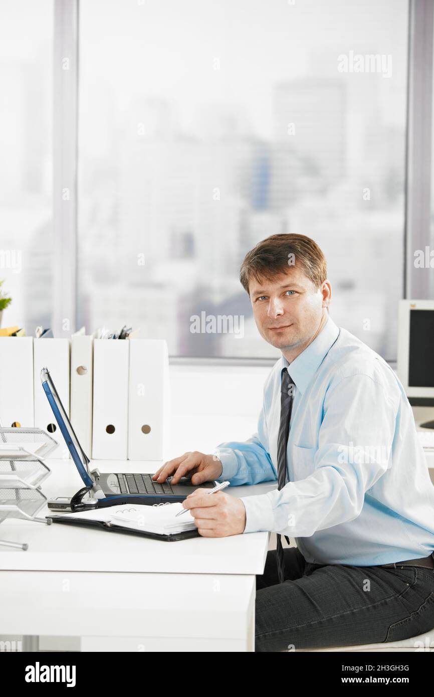 Employee taking work notes using hi-res stock photography and images ...