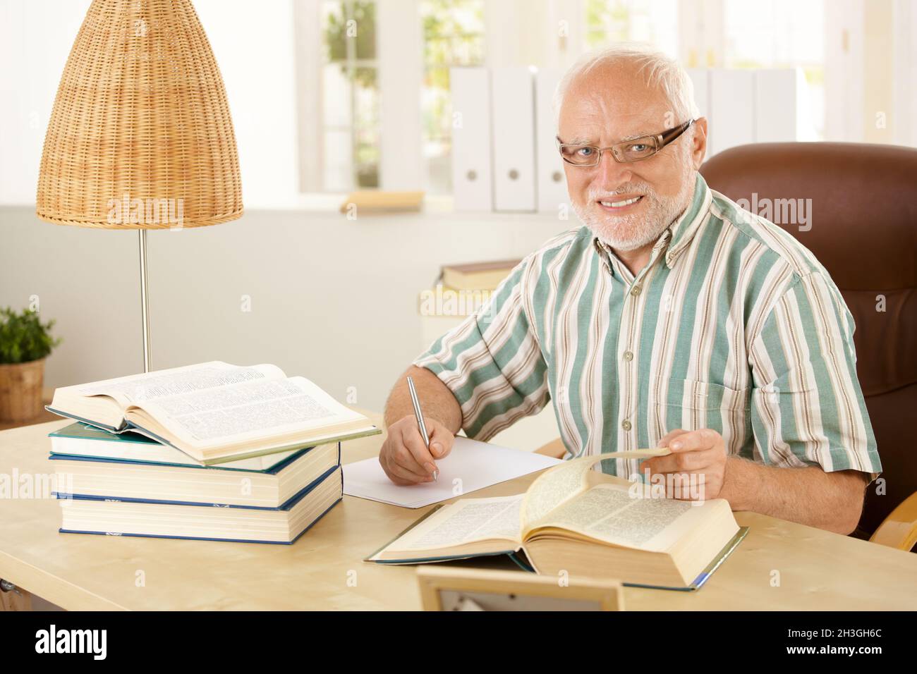 Elderly professor working in his study Stock Photo - Alamy