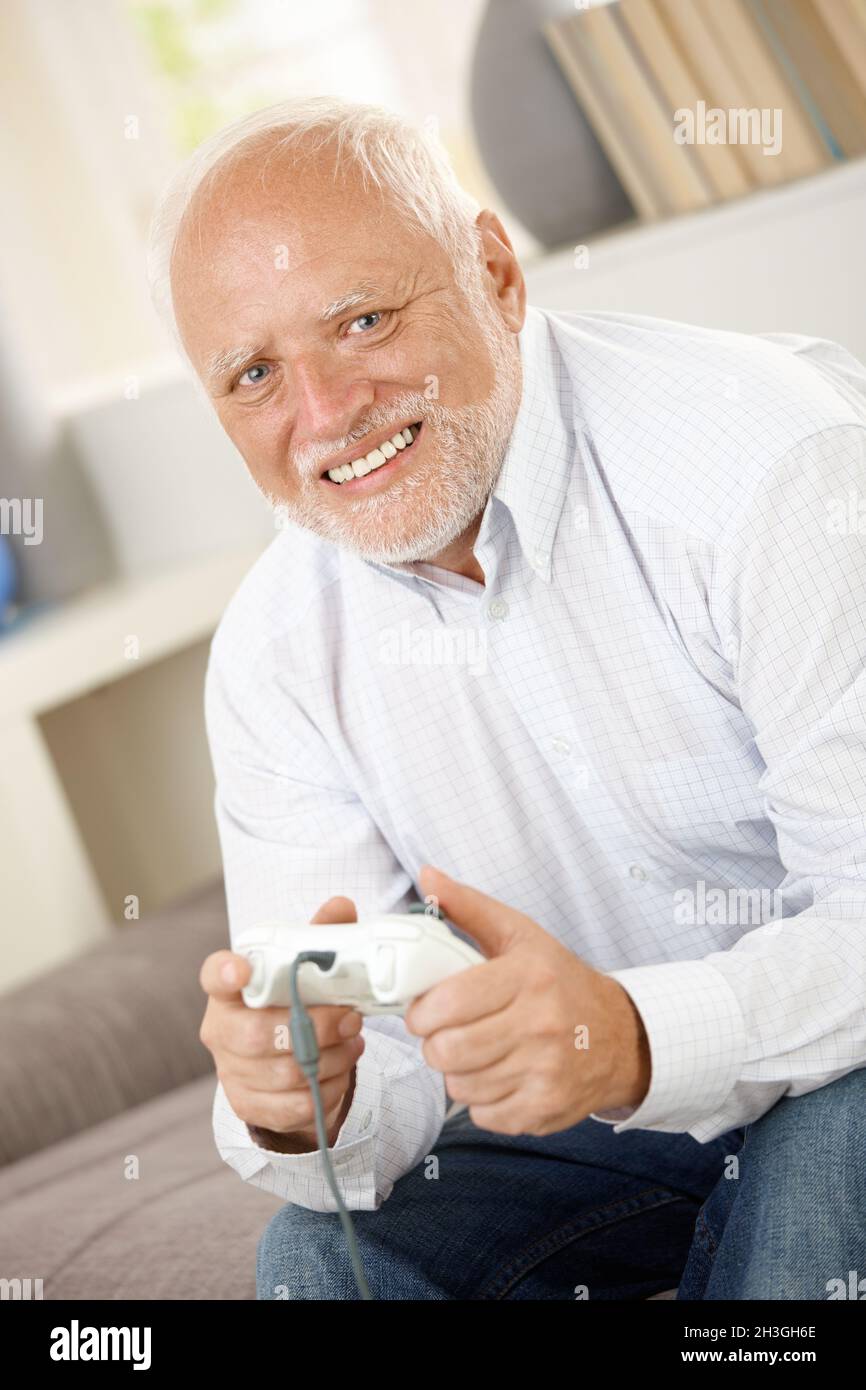 Portrait of modern senior playing computer game Stock Photo - Alamy