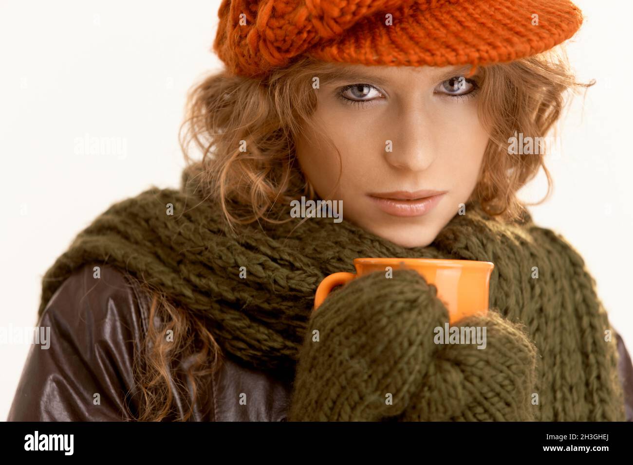 Pretty young woman dressed up warm drinking tea Stock Photo - Alamy