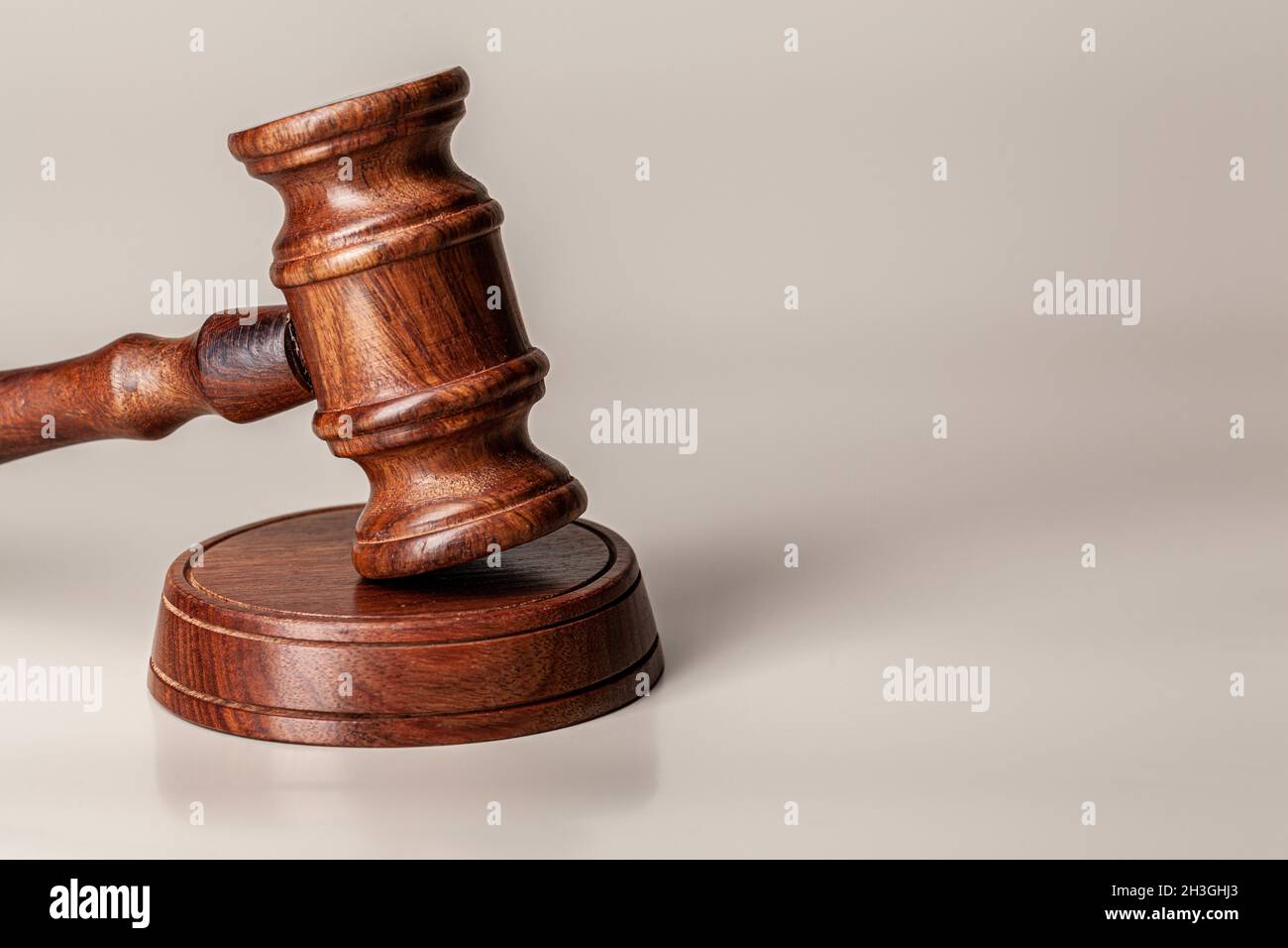 Wooden judges gavel on table close up Stock Photo - Alamy