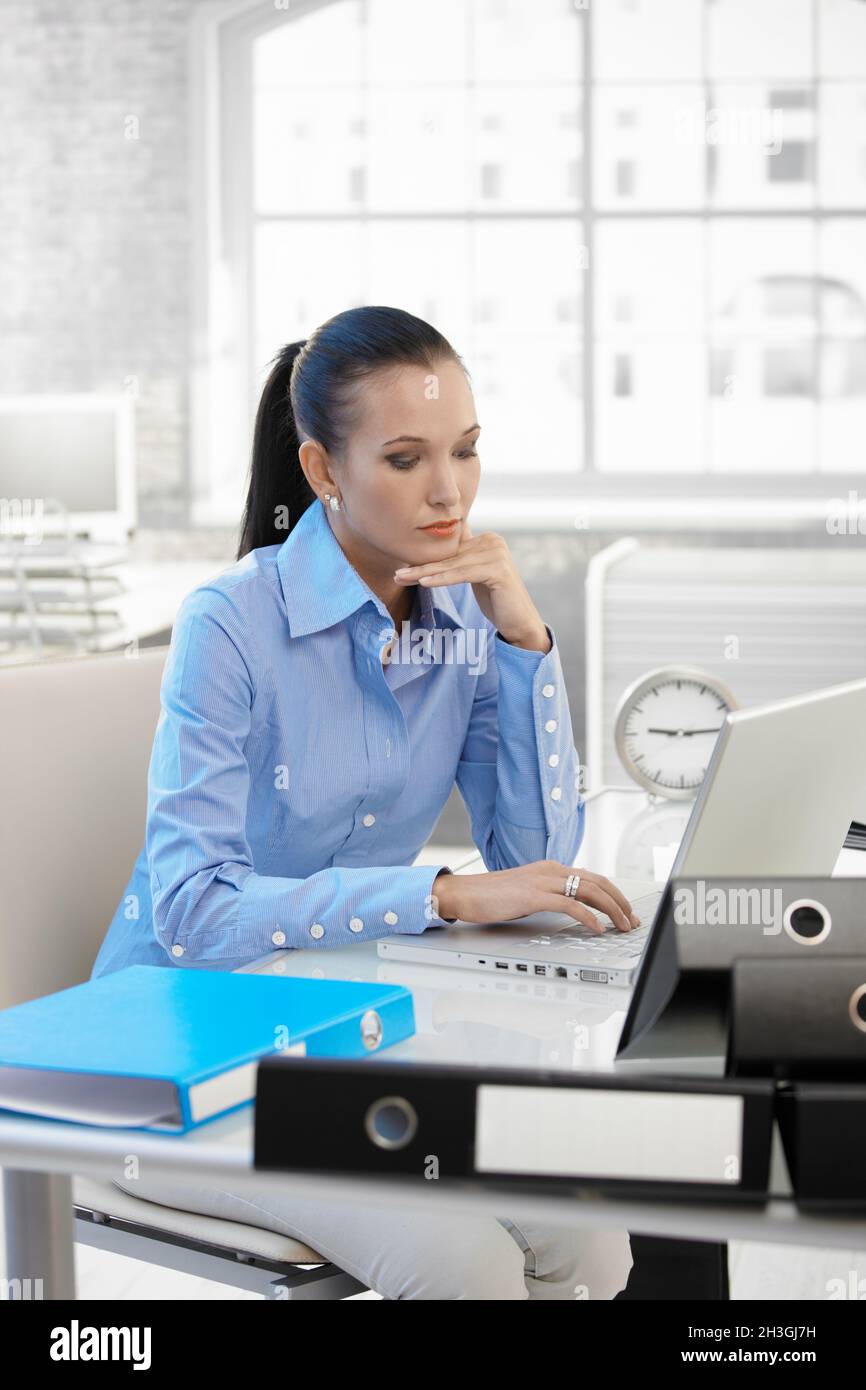 Young people at work only one thinking hi-res stock photography and ...