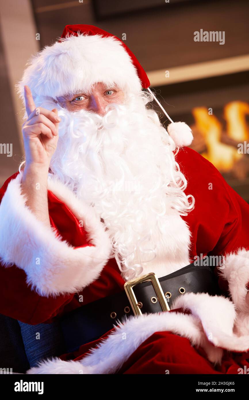 Santa Claus raising finger Stock Photo - Alamy