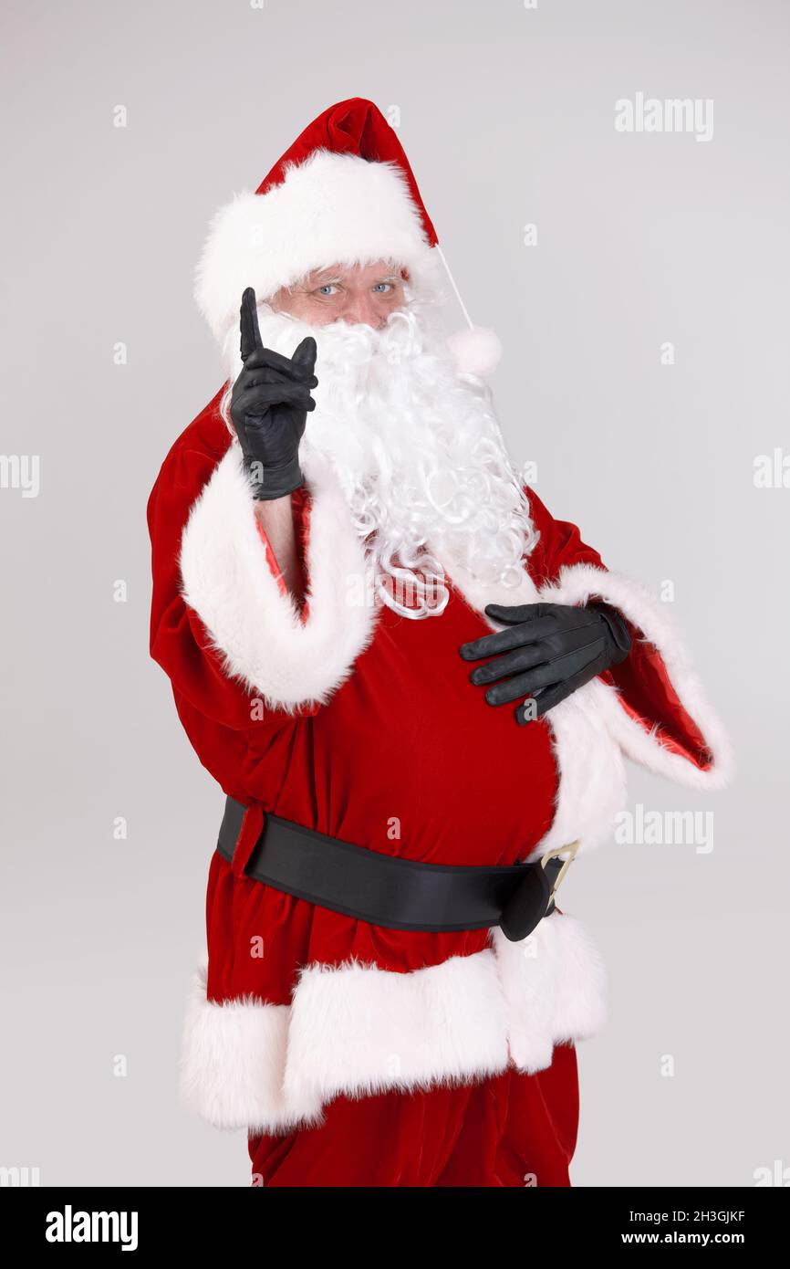 Santa pointing up with finger Stock Photo - Alamy