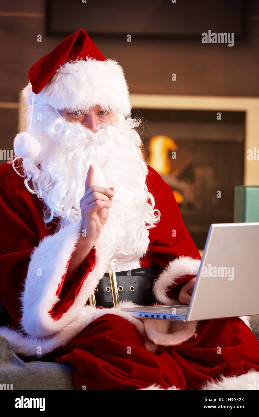 Santa using computer Stock Photo - Alamy