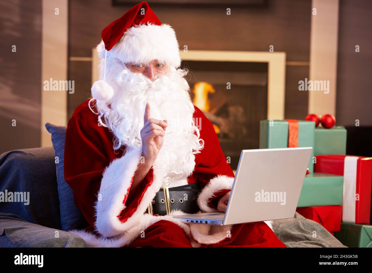 Santa using computer Stock Photo - Alamy