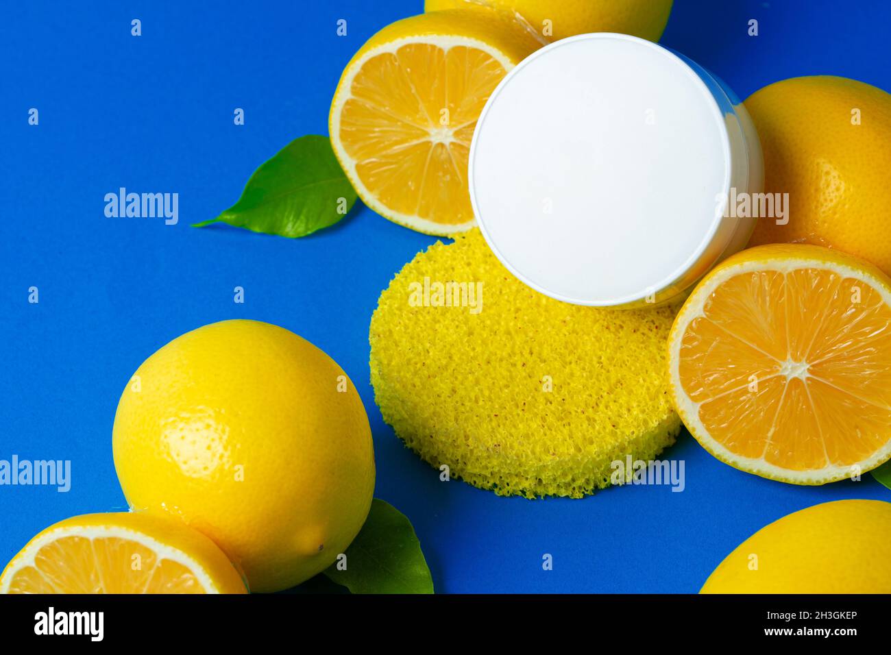 Bottle of skincare cosmetics with sliced lemons Stock Photo - Alamy