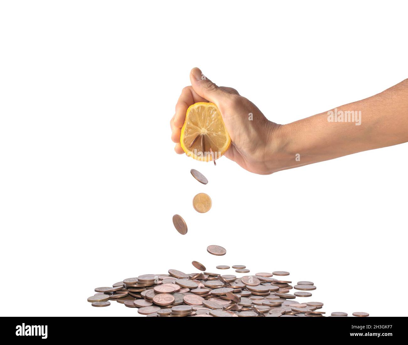 Human hand squeezing a lemon from which coins come out. Coins falling ...