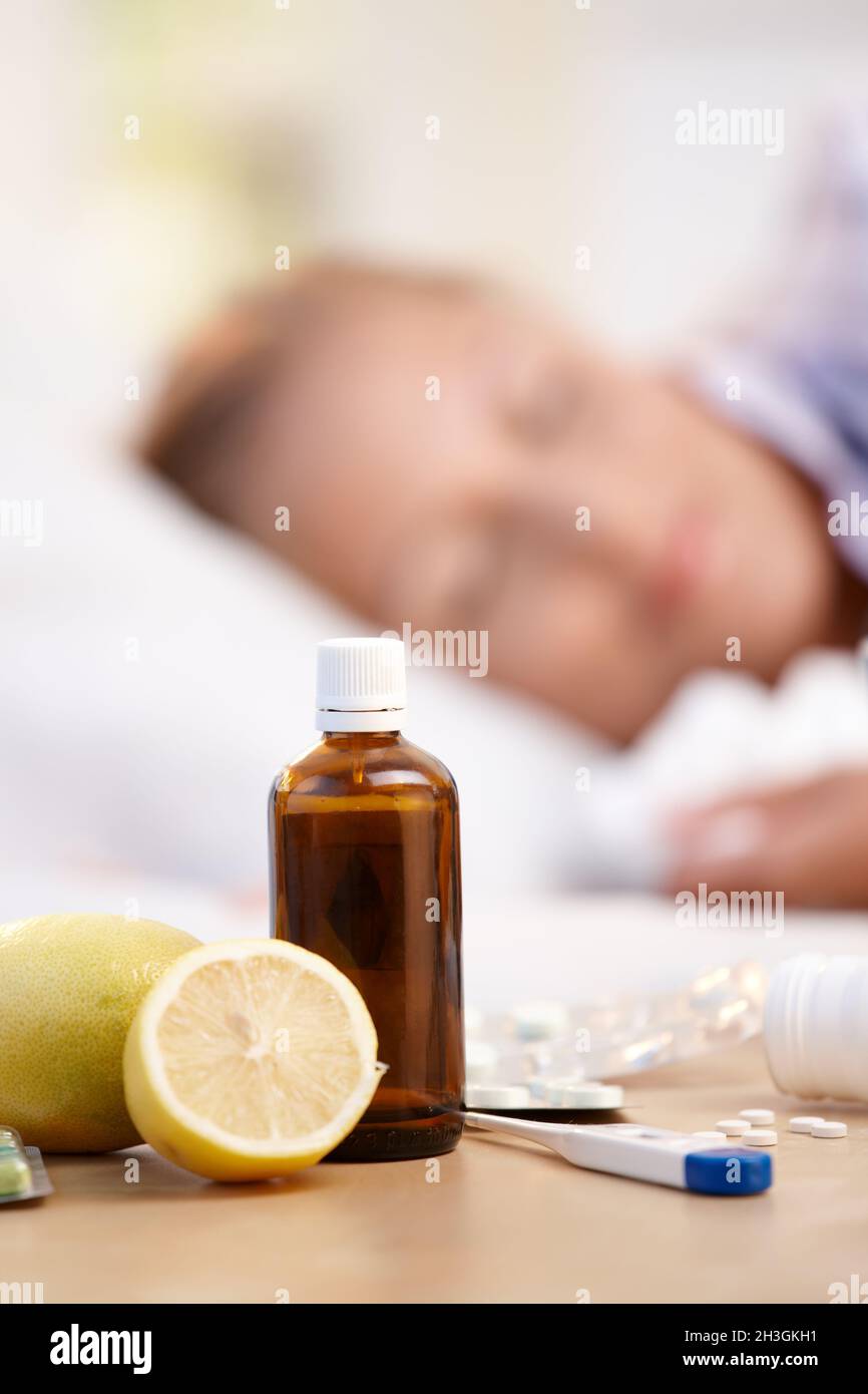 Vitamins medicines for flu woman in background Stock Photo - Alamy