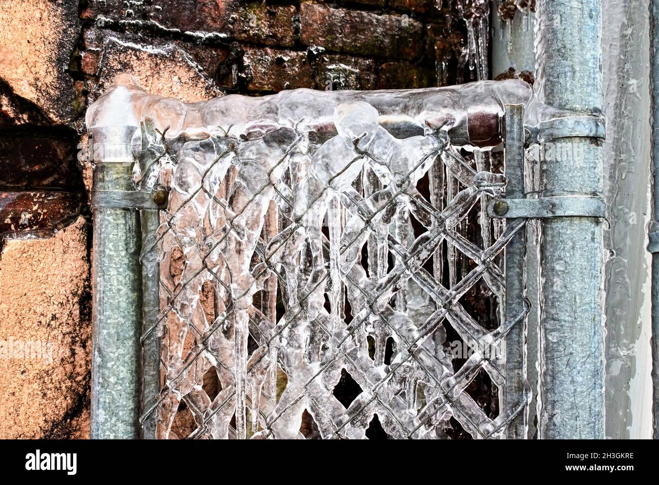 Ice-covered chain link gate Stock Photo - Alamy