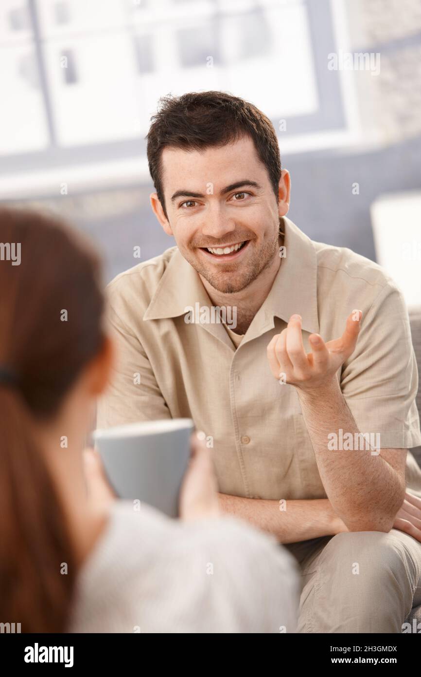 Happy young man chatting on hi-res stock photography and images - Alamy