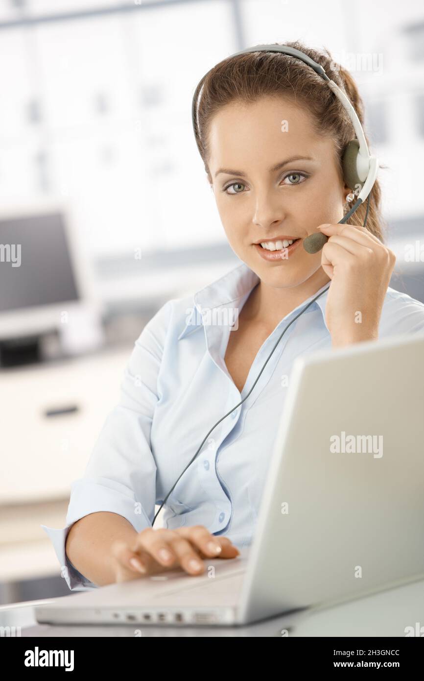 Smiling customer service taking hi-res stock photography and images - Alamy