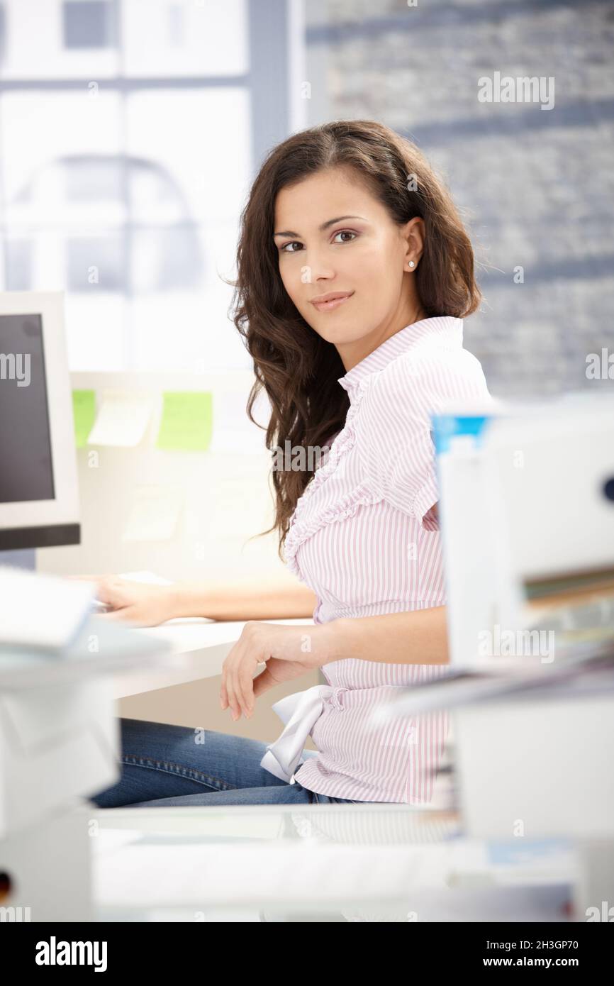 Young secretary working on computer in office Stock Photo - Alamy