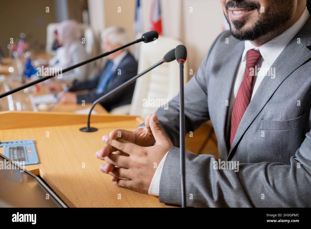 Politician holding microphone standing hi-res stock photography and ...