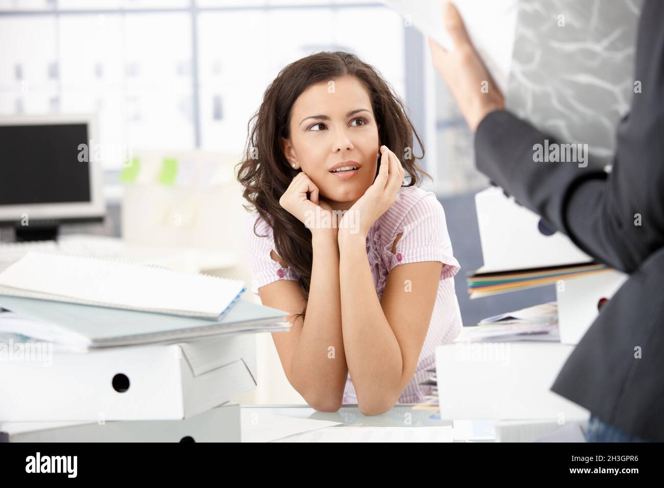 Young secretary sitting shocked in office Stock Photo - Alamy