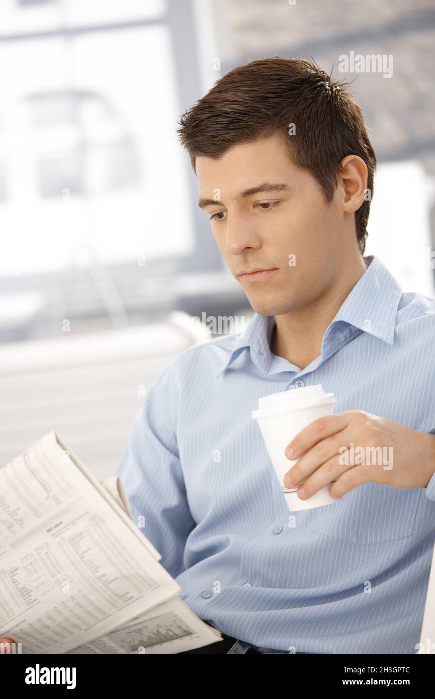 Male read papers hi-res stock photography and images - Alamy