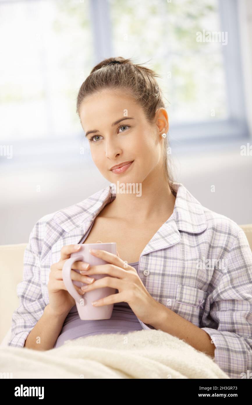 Beautiful woman having morning tea Stock Photo - Alamy
