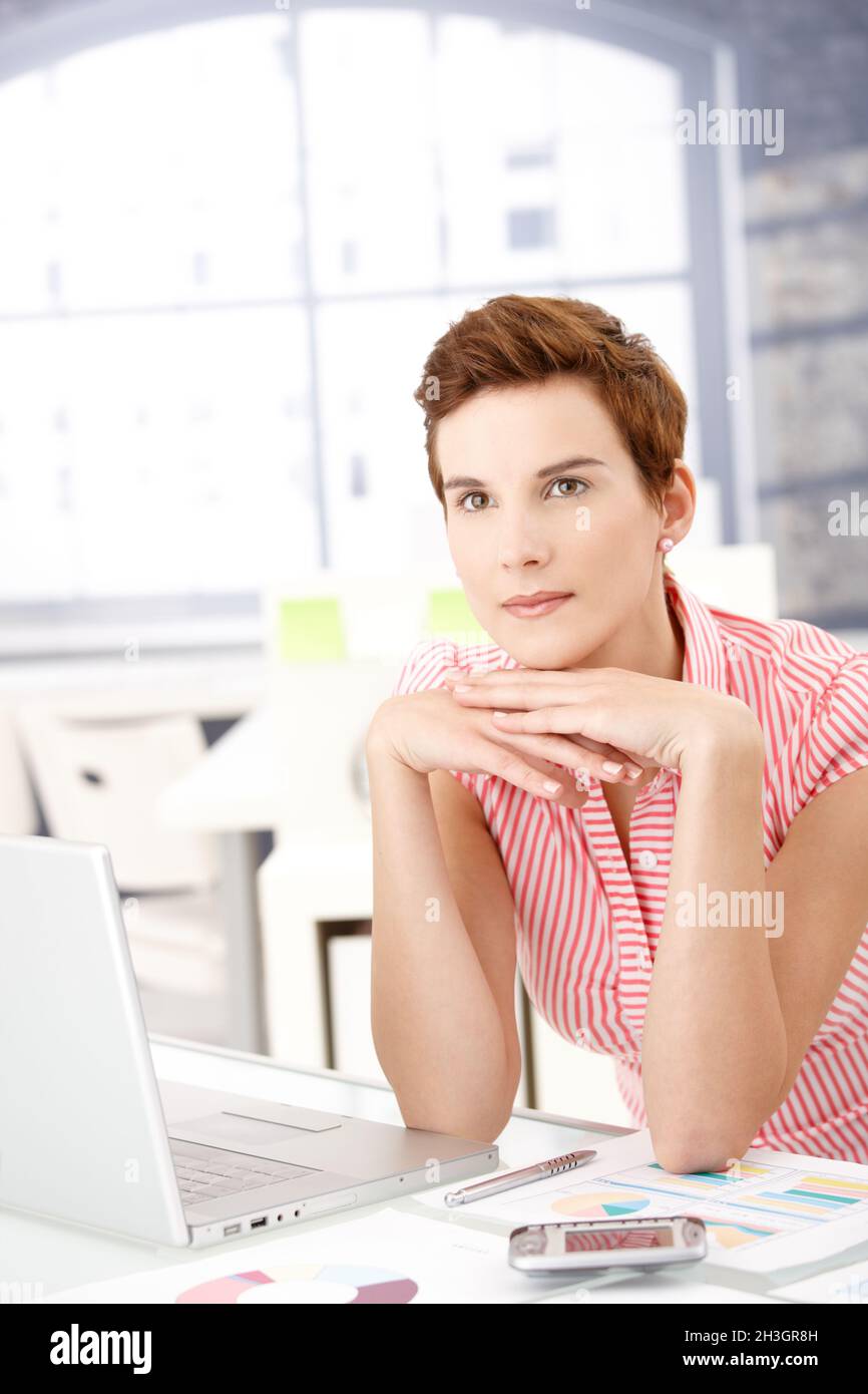 Female office worker thinking Stock Photo - Alamy