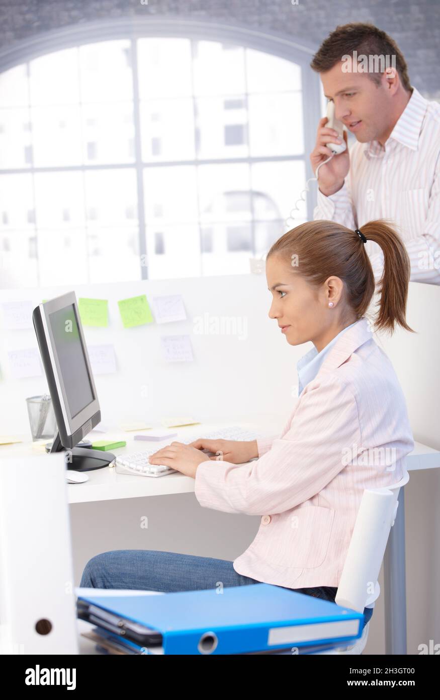 Woman office files busy computer hi-res stock photography and images ...