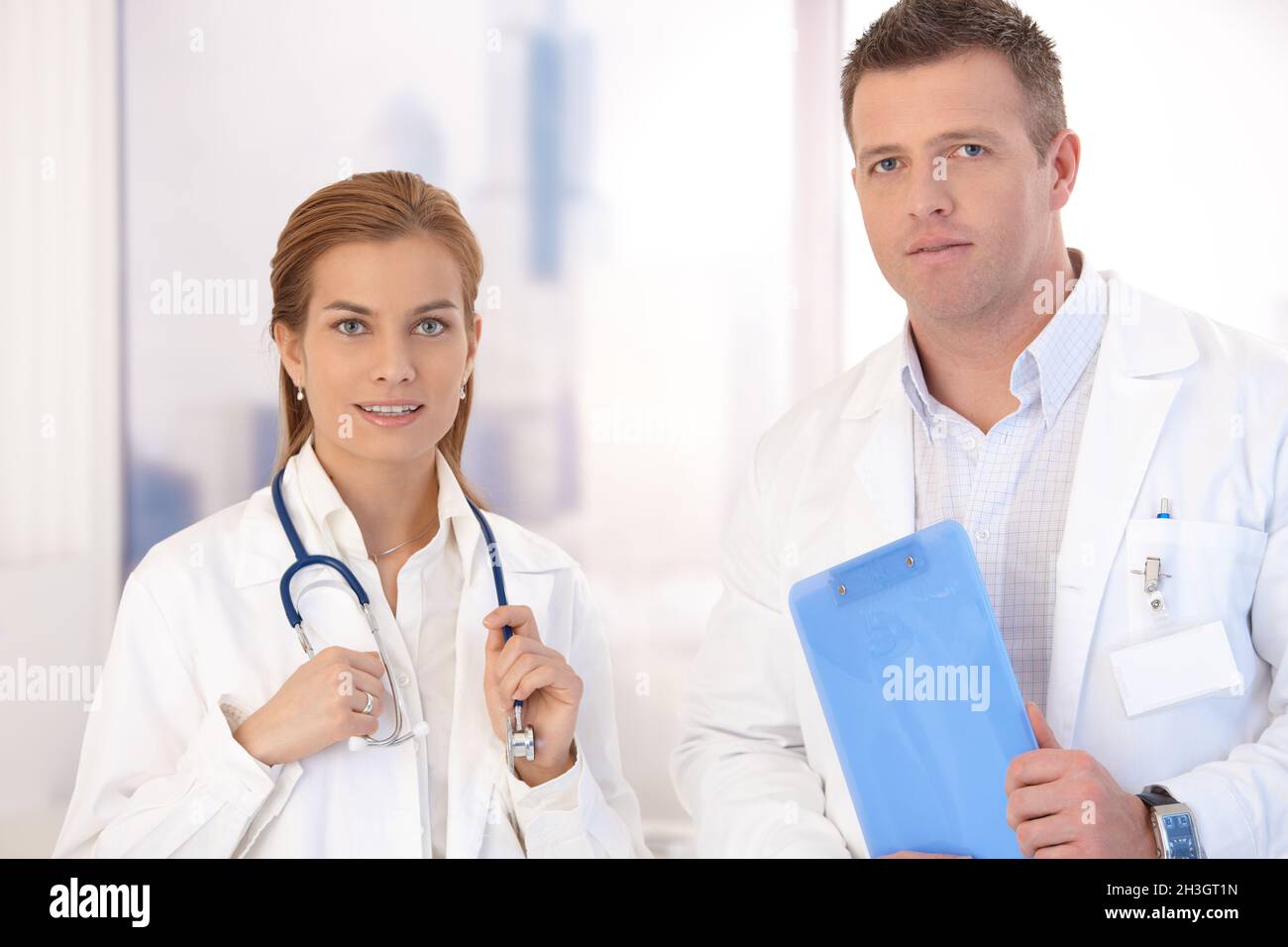 Portrait of young attractive doctors Stock Photo - Alamy