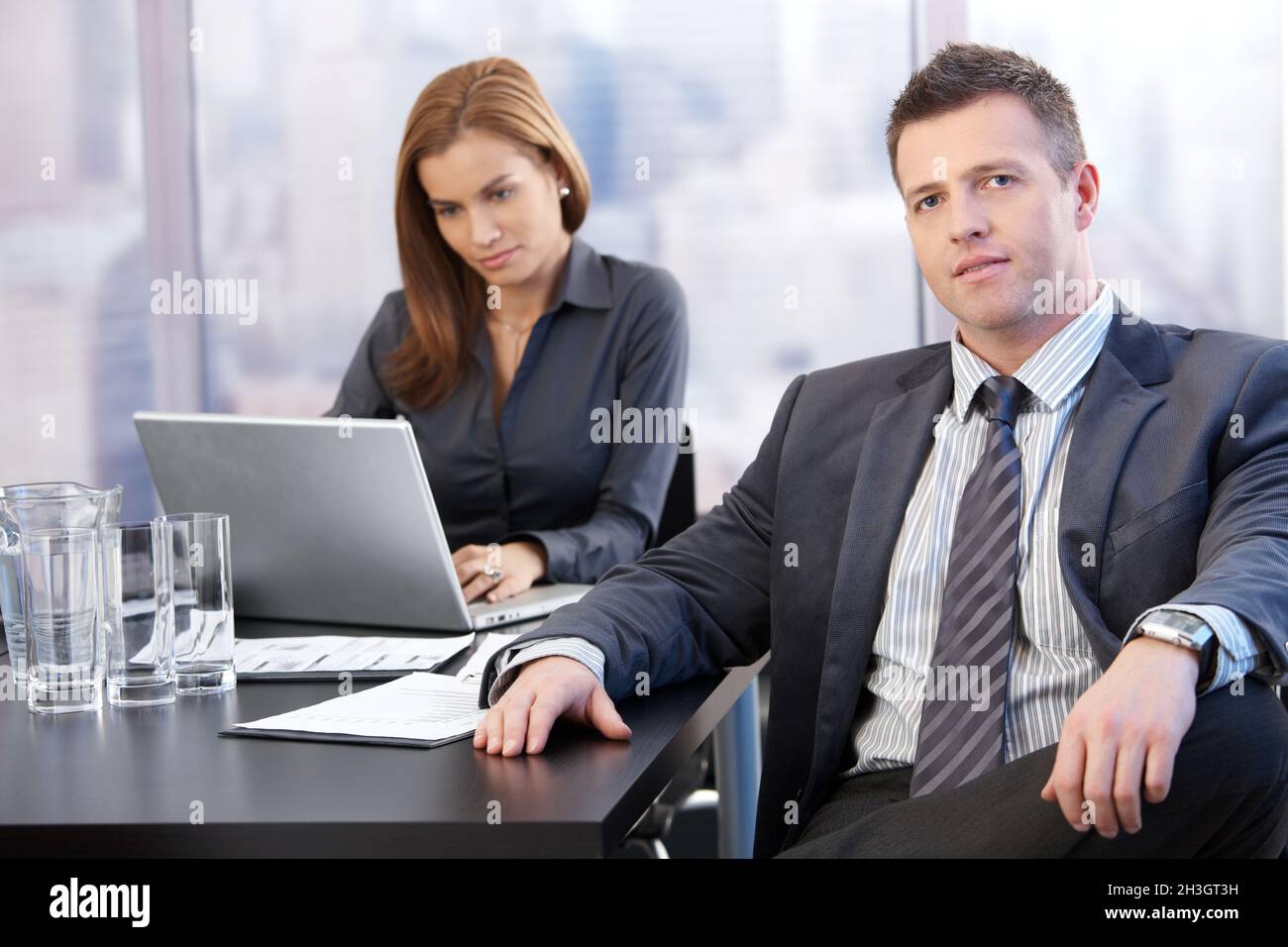 Boss and assistant in meeting room Stock Photo - Alamy