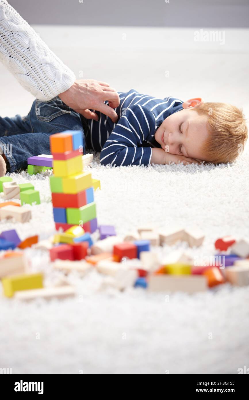 Little boy getting tired in playing Stock Photo - Alamy