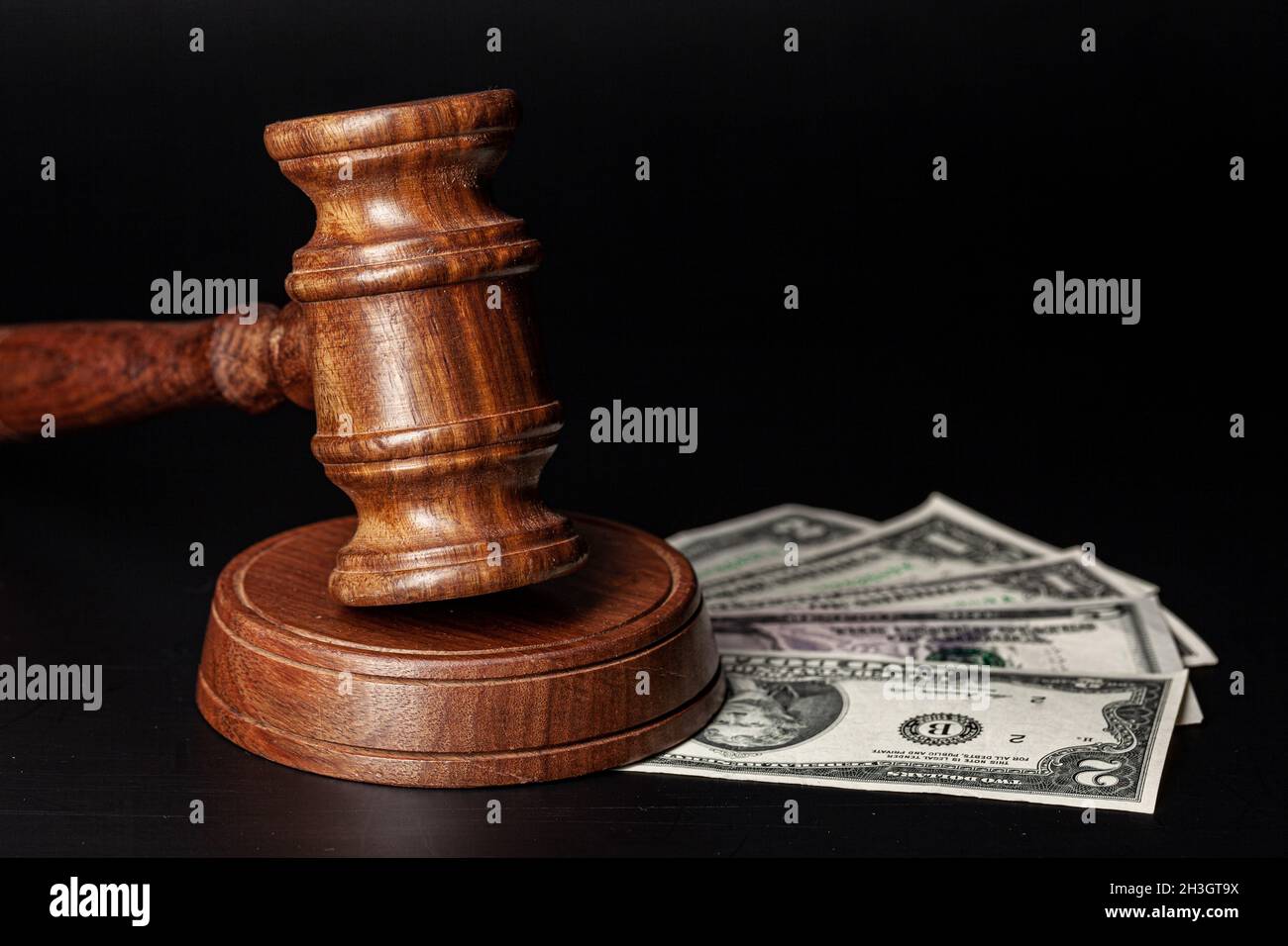 Law mallet and a stack of money Stock Photo - Alamy