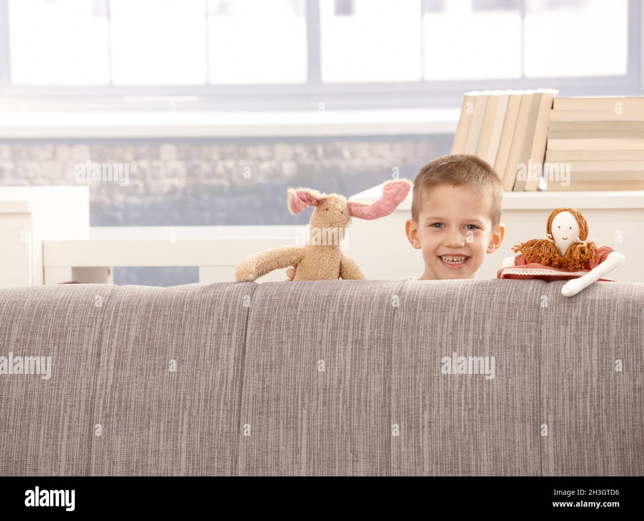 Cute little boy with toys Stock Photo - Alamy