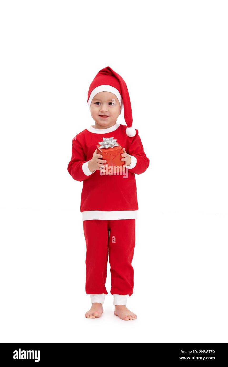 Cute kid in santa costume with gift Stock Photo - Alamy