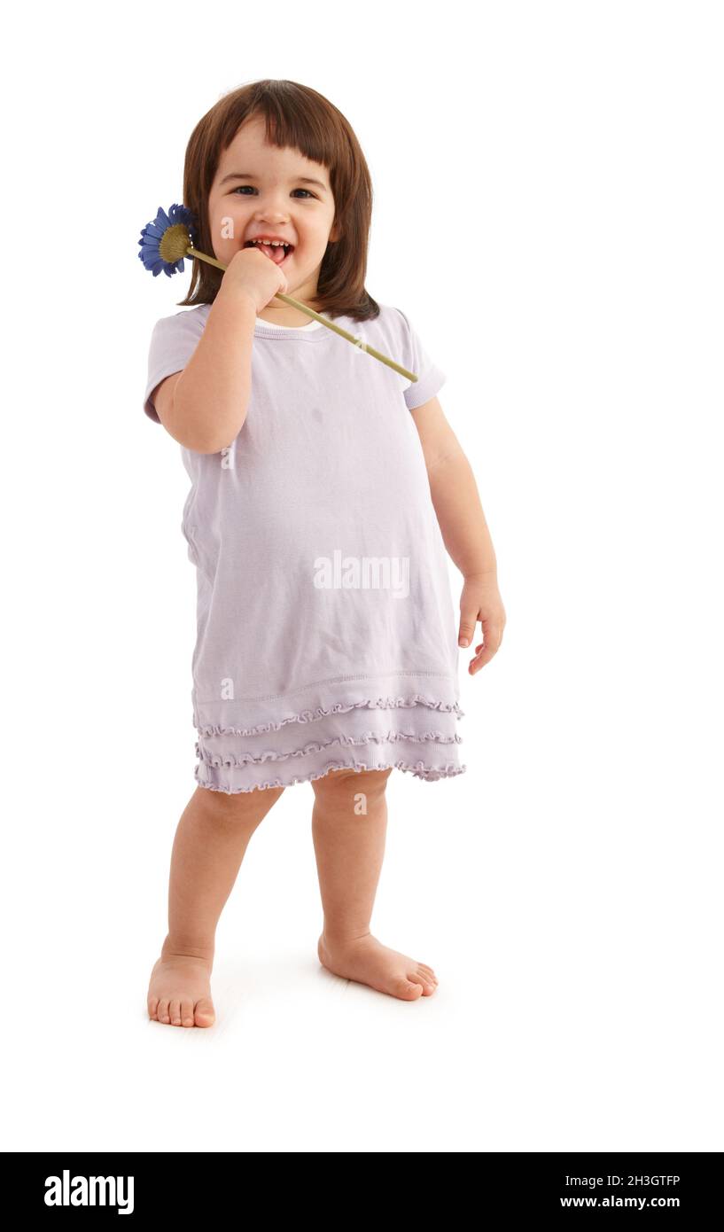 Happy kid posing with flower Stock Photo - Alamy