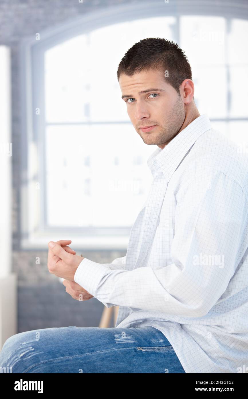 Young handsome looking man dressing hi-res stock photography and images ...