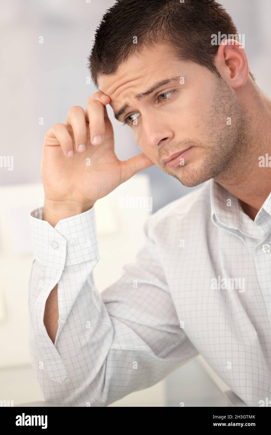 Goodlooking man having headache Stock Photo - Alamy