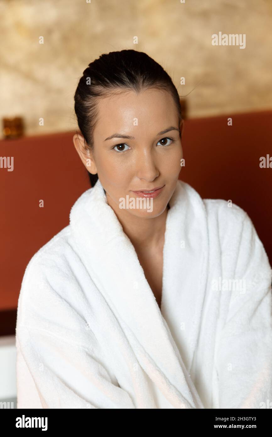 Young woman in bathrobe sit hi-res stock photography and images - Alamy
