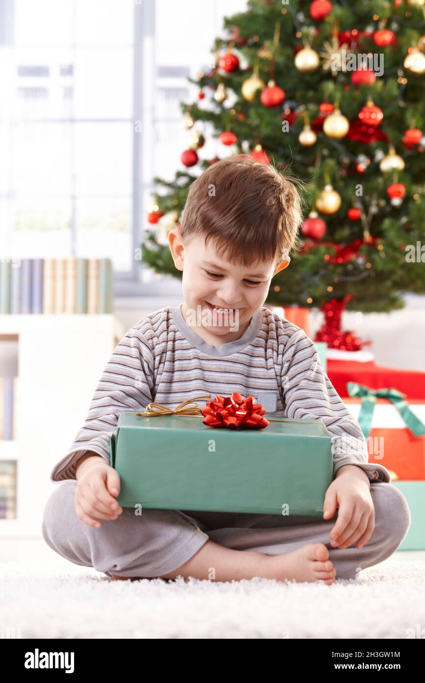 Child getting present christmas hi-res stock photography and images - Alamy