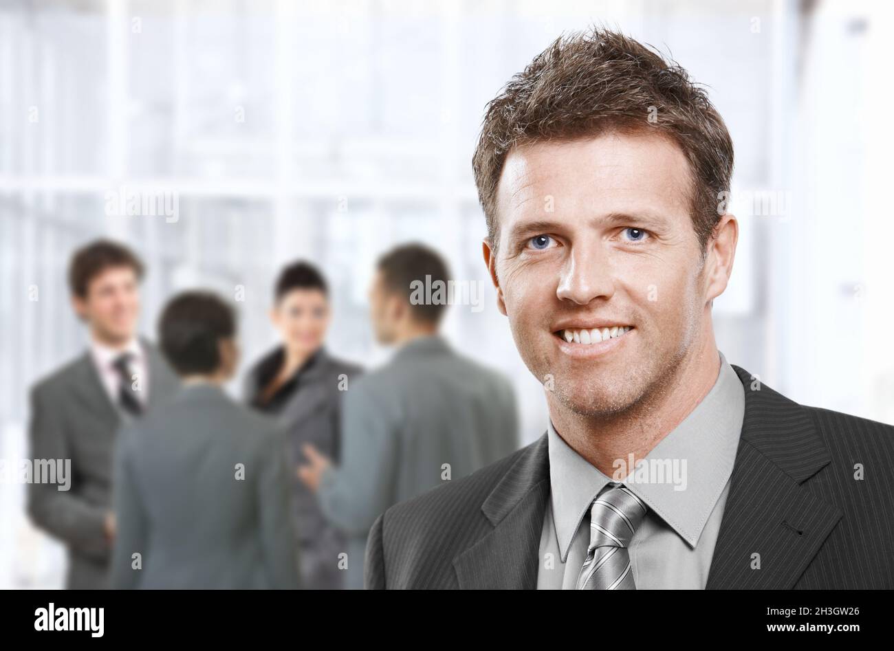 Smart smiling man hi-res stock photography and images - Alamy