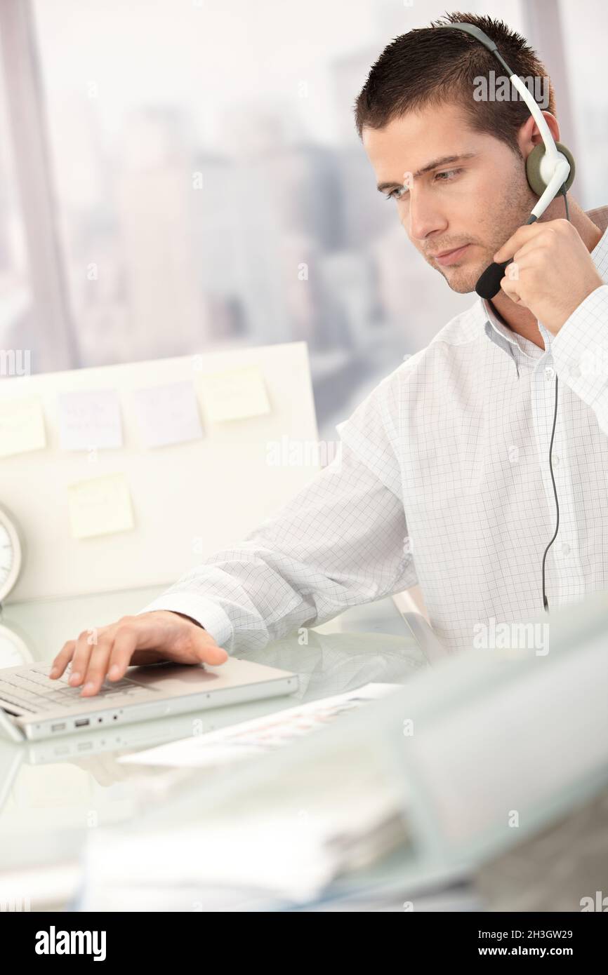 Young male dispatcher working hi-res stock photography and images - Alamy