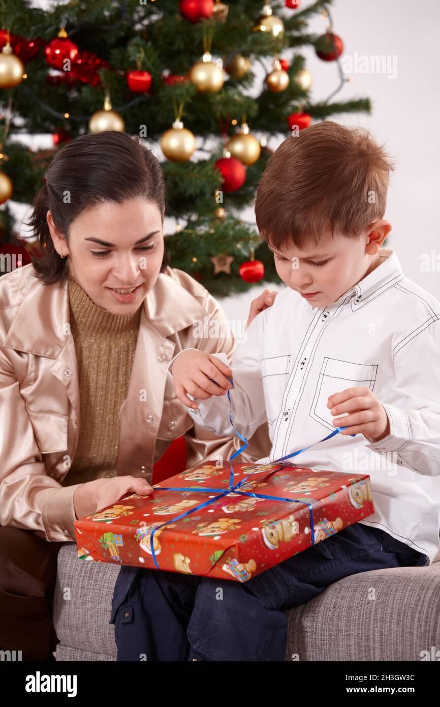 Mother and son opening presents Stock Photo - Alamy