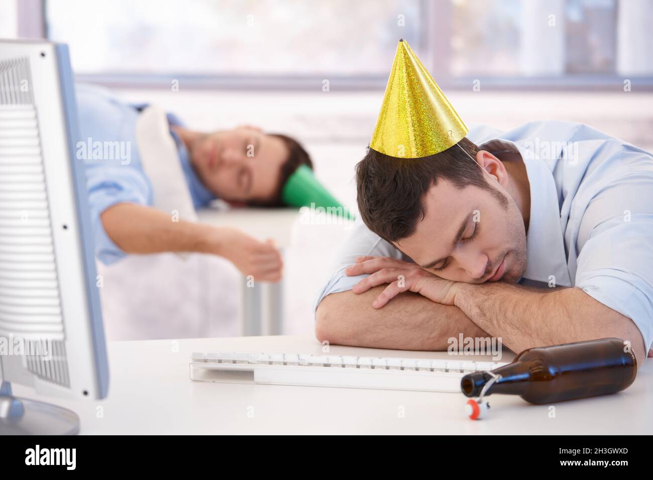 Hangover after office party Stock Photo - Alamy