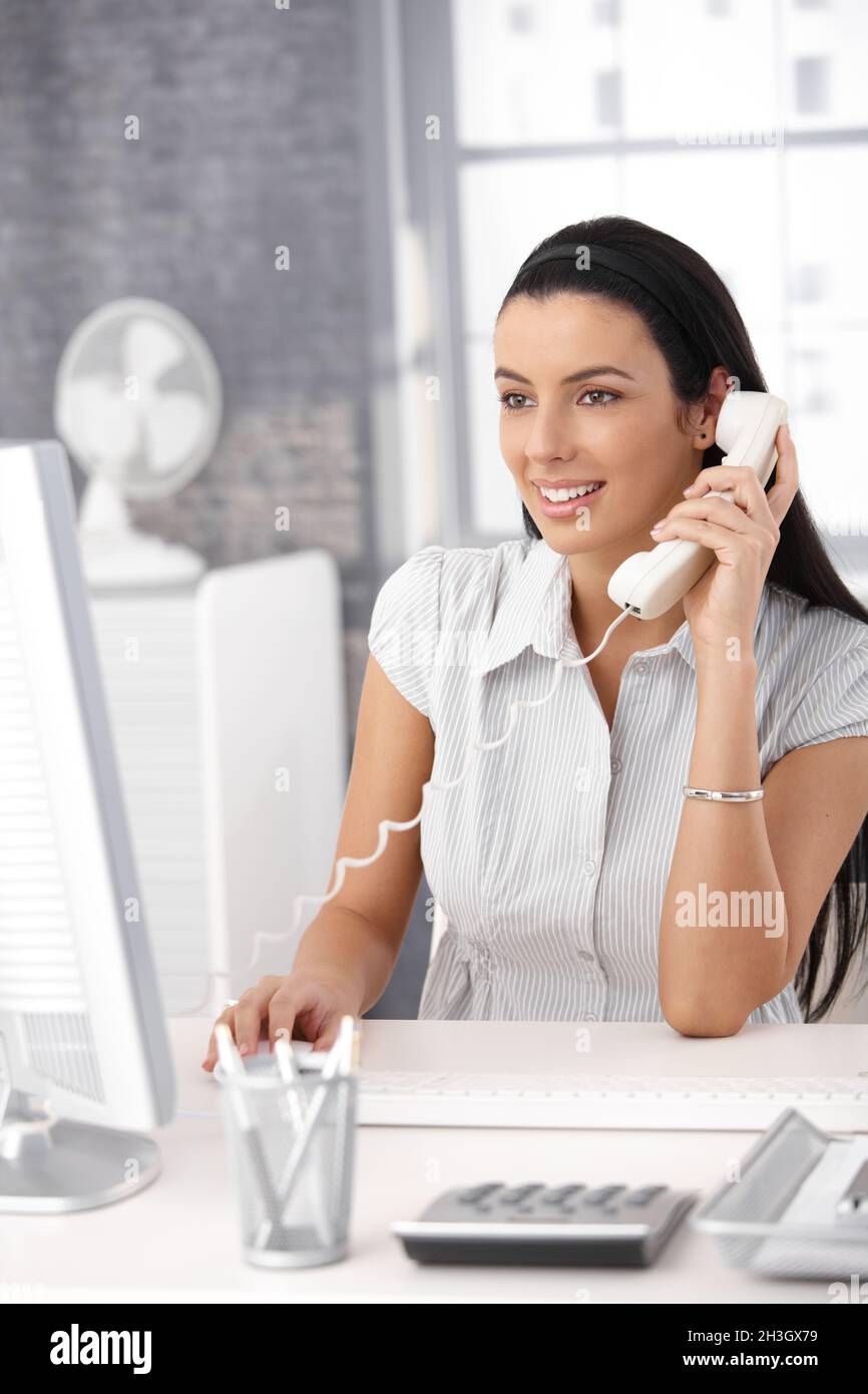 Happy office girl at work Stock Photo - Alamy