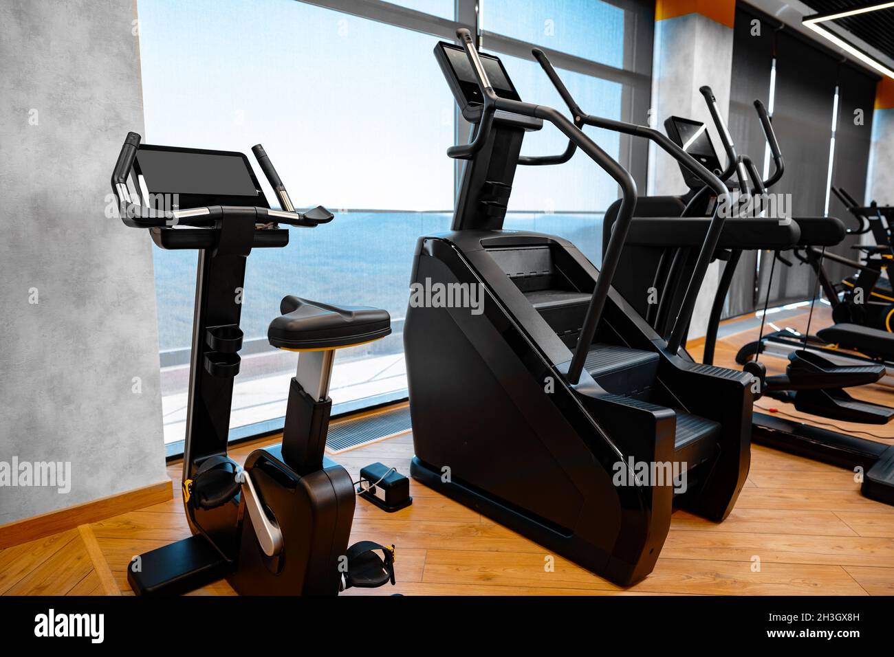 Modern gym interior with new fitness equipment Stock Photo - Alamy