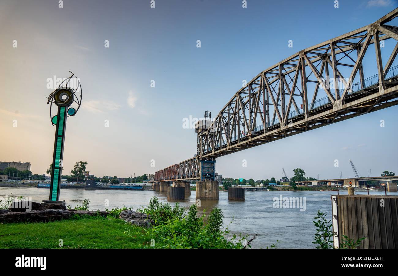 Pratt truss bridge over a river under the sunlight and a blue sky Stock ...